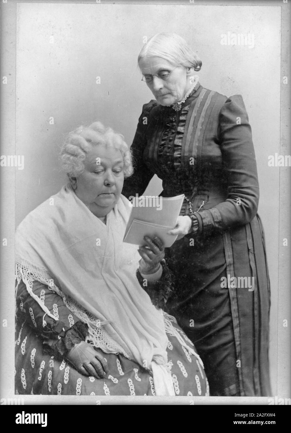 Elizabeth Cady Stanton, seated, and Susan B. Anthony, standing, three ...