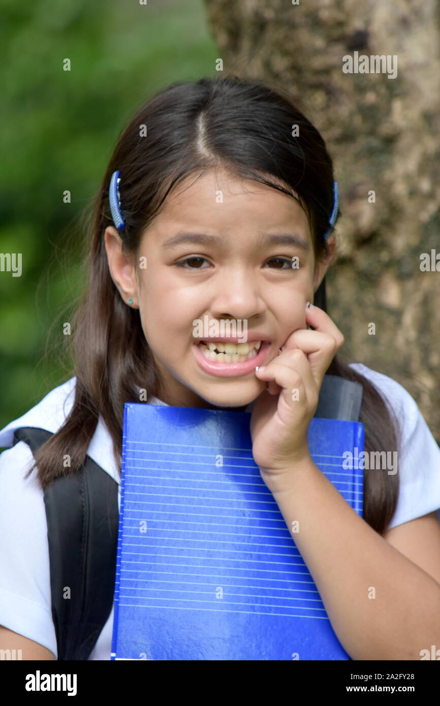 Diverse Female Student Under Stress Wearing Uniform Stock Photo - Alamy