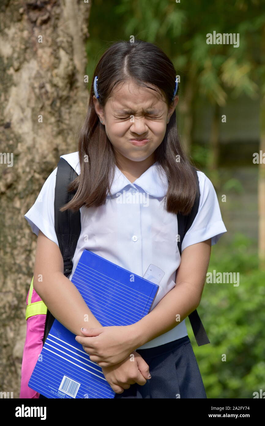 School Girl And Anxiety Wearing School Uniform With Books Stock Photo ...