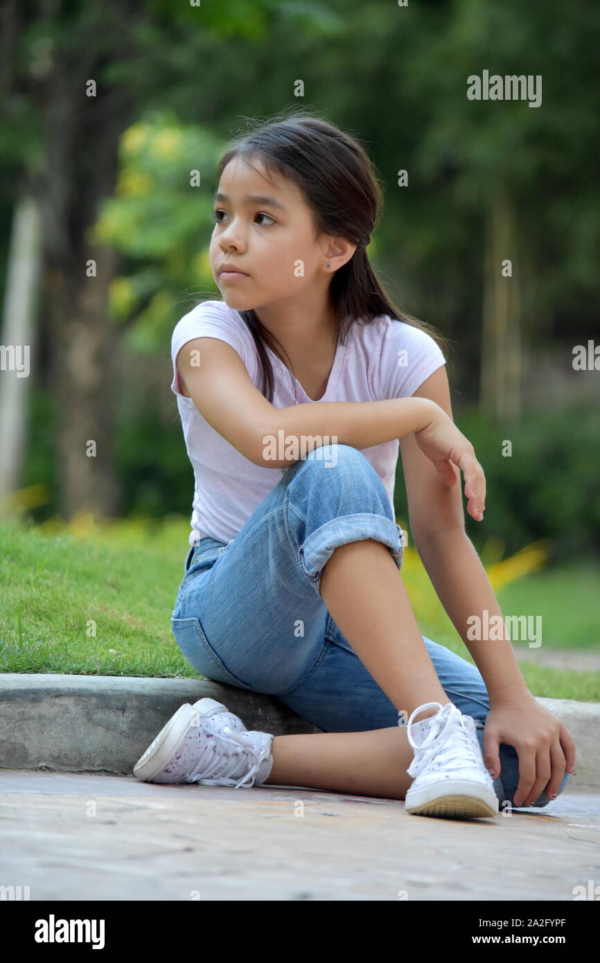A Relaxing Beautiful Female Sitting Stock Photo - Alamy