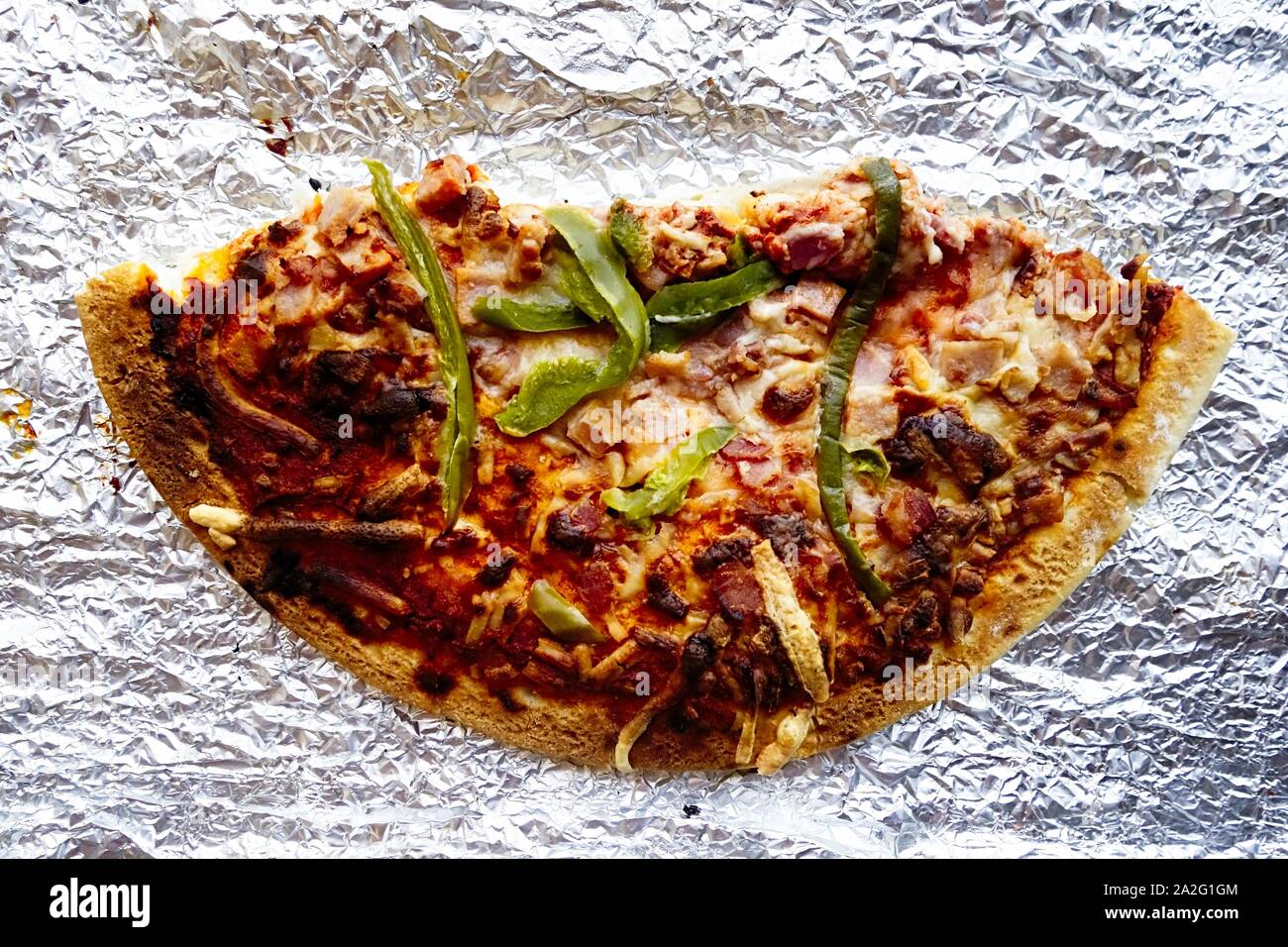 Left Over Cooked Cold Pizza on Aluminium Foil Stock Photo - Alamy