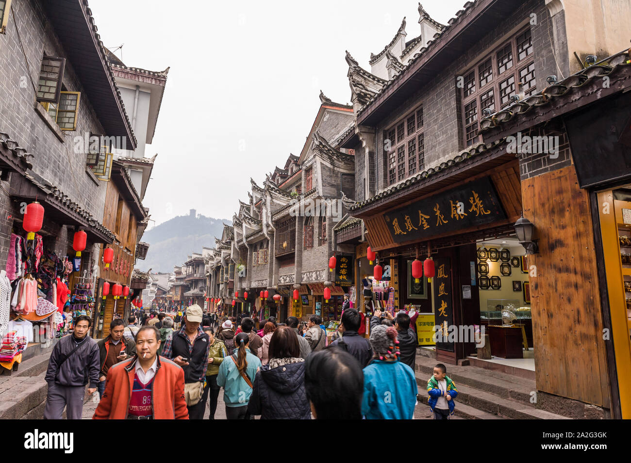 Hunan, China, 14 Nov 2011: Busy street of tourists in Phoenix Ancient ...