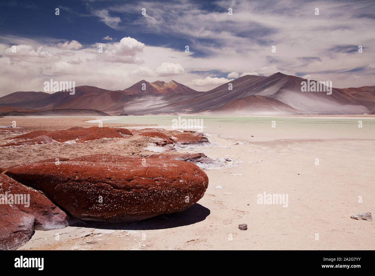 Red Rocks (Piedras Rojas) and lagoon and salt flats in Atacama Desert ...