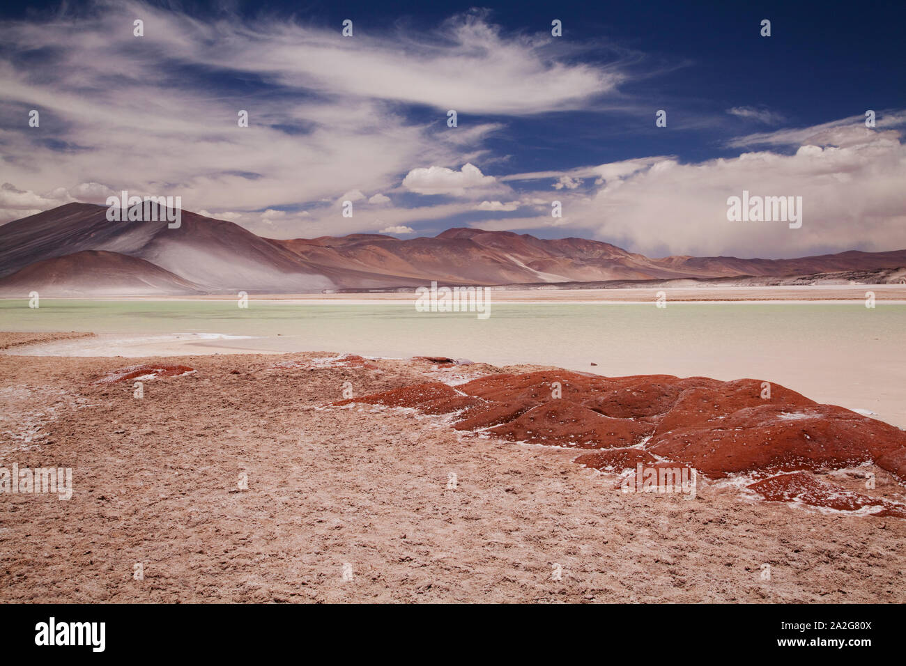 Red Rocks (Piedras Rojas) and lagoon and salt flats in Atacama Desert ...