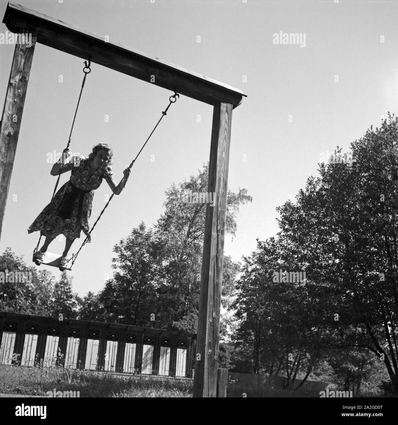 [young woman standing on Black and White Stock Photos & Images - Alamy