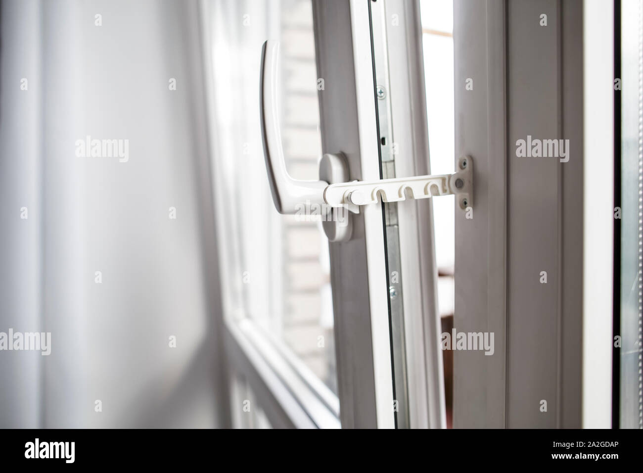 Safe restrictor lock prevents accidental shut the opened window Stock ...