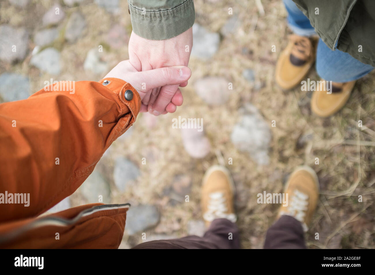 View from above on the legs of a man and a woman standing opposite each ...