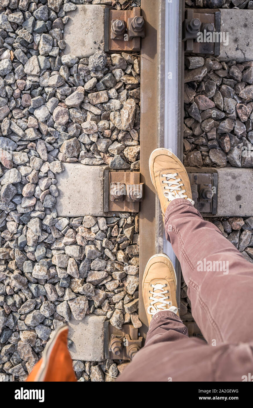 Man walking along train tracks hi-res stock photography and images - Alamy