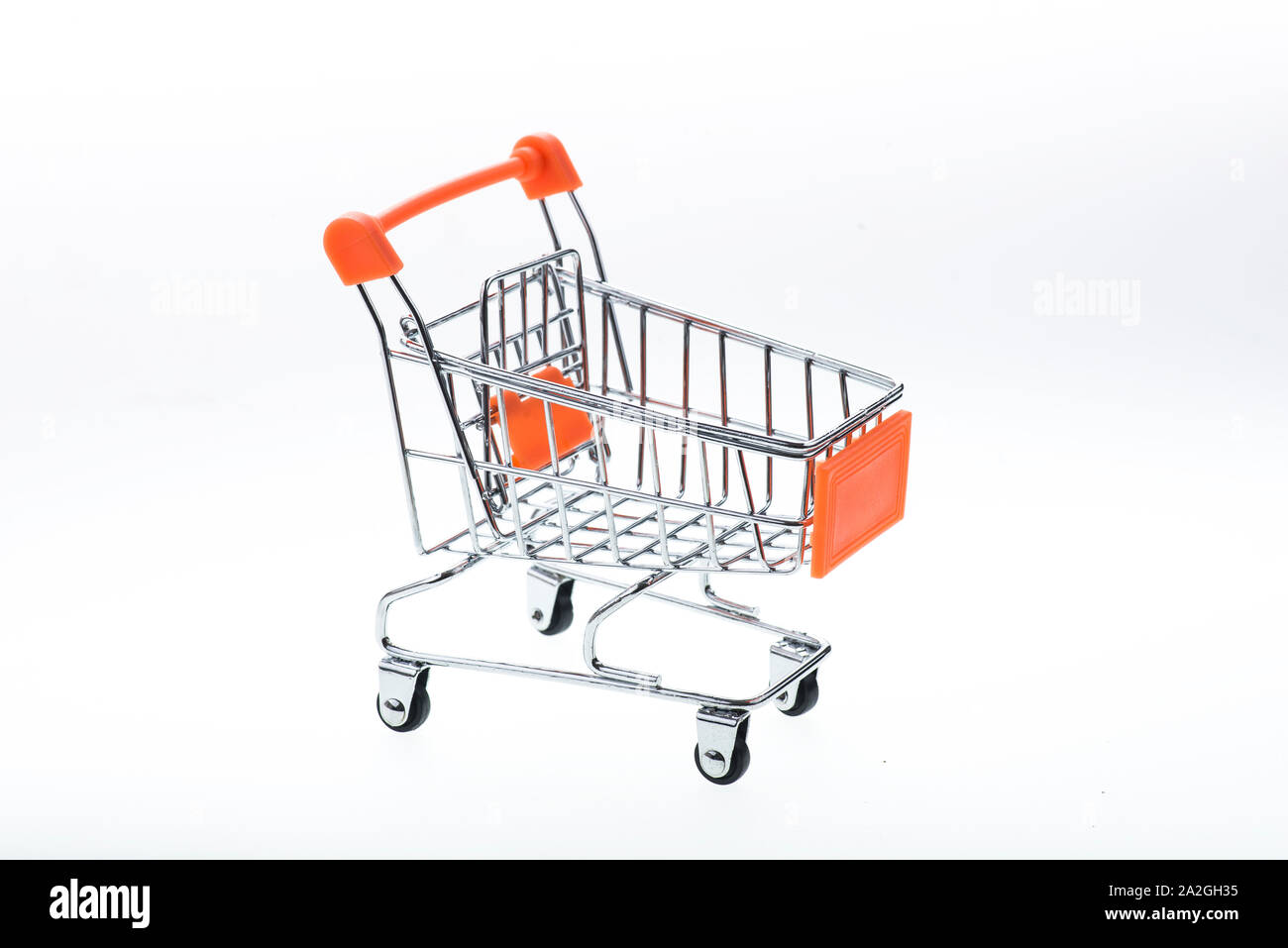 Mini shopping cart isolated on white background Stock Photo - Alamy