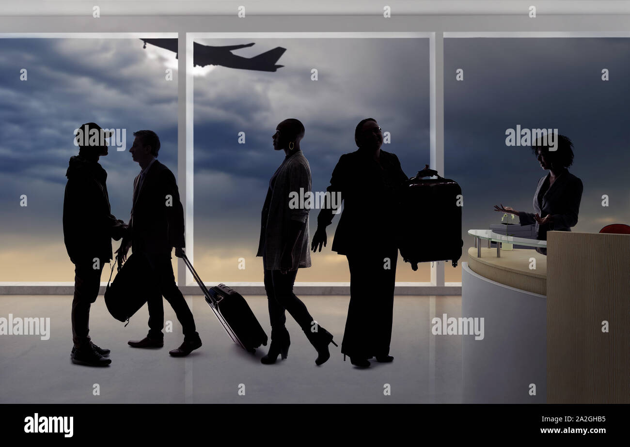 Silhouettes of passengers waiting in line at an airport check in ...