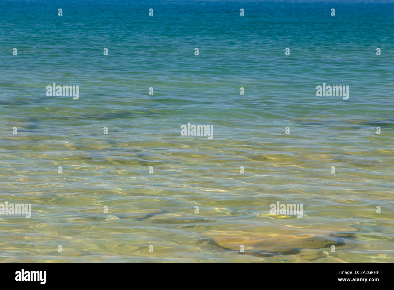 Clear water texture in blue and orange. Background of the ocean and the ...