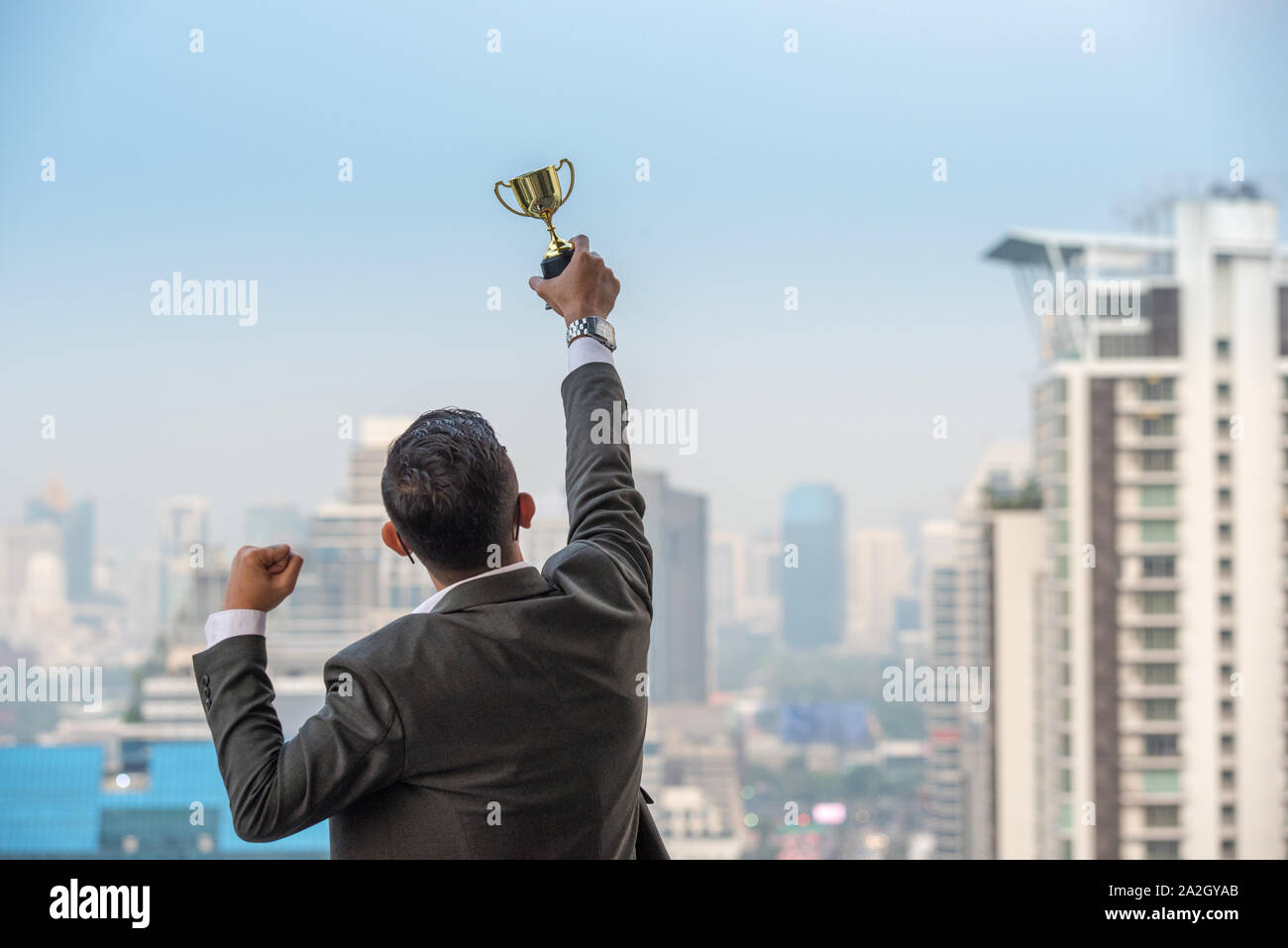 Celebrating trophy cup hi-res stock photography and images - Alamy