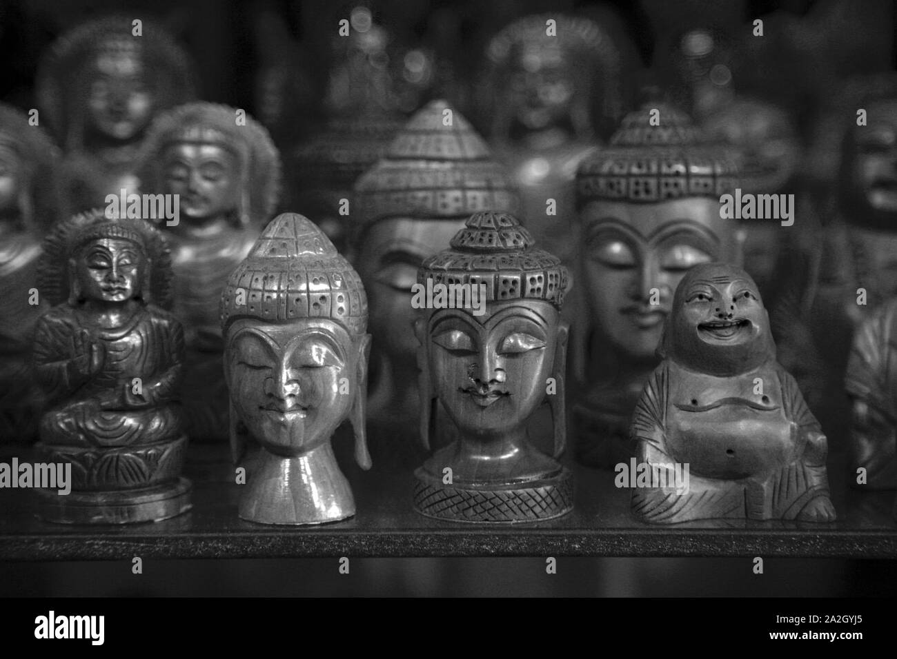 Figurines of Buddha and deity in the souvenir shop of the Indian town ...
