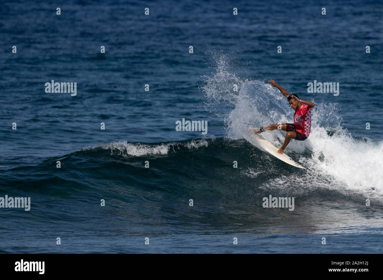 A surfer taking part in the Philippine National surfing Championships ...