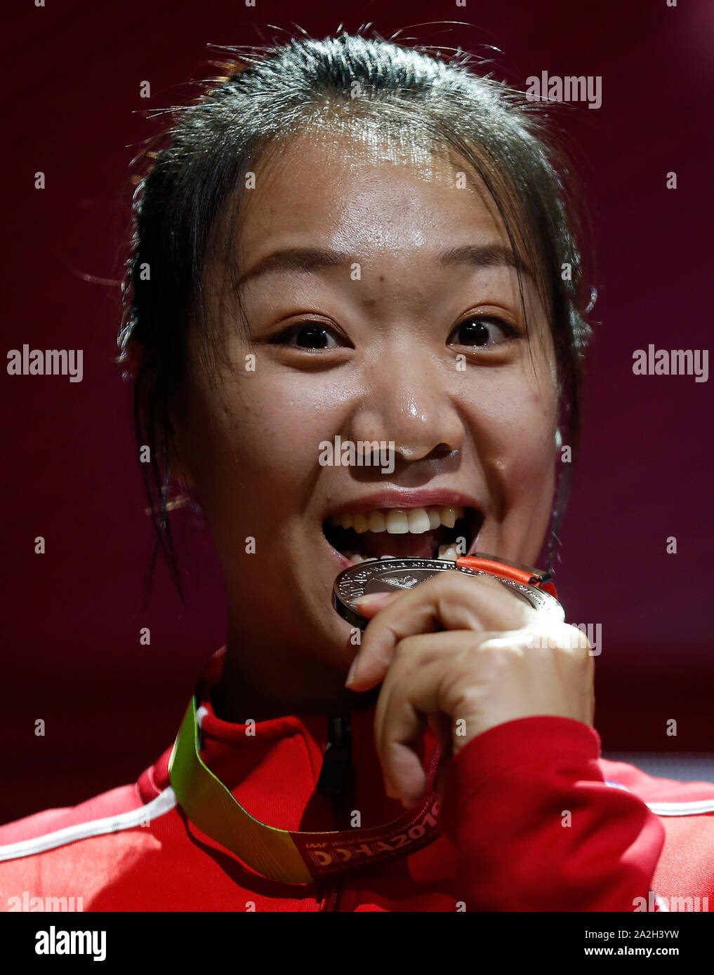 Doha, Qatar. 2nd Oct, 2019. Silver medalist Liu Shiying of China bites ...