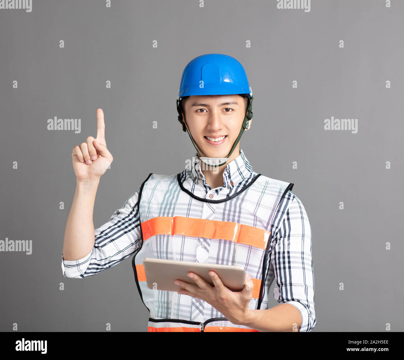 smiling asian young man construction worker Stock Photo - Alamy