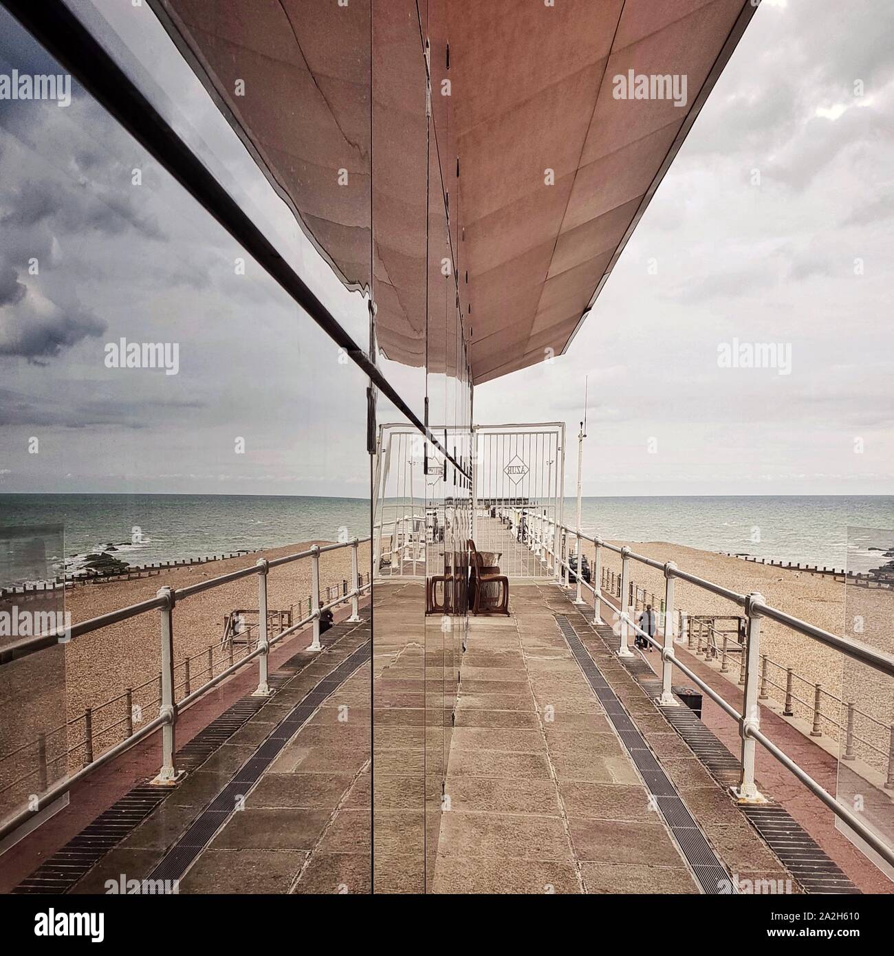A reflection on a window of the sea and beach Stock Photo - Alamy