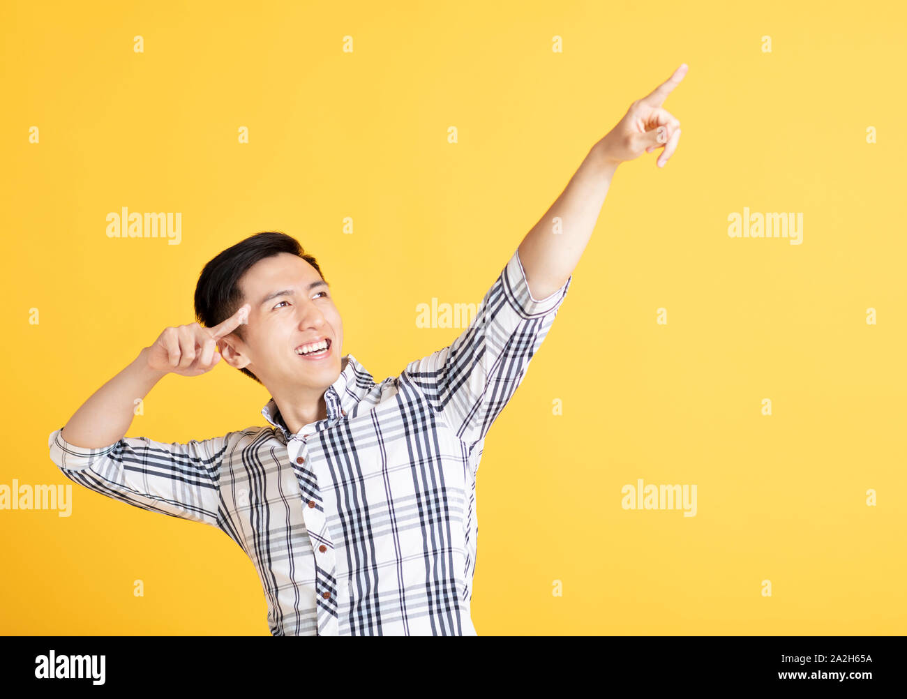 Cheerful handsome guy showing hi-res stock photography and images - Alamy