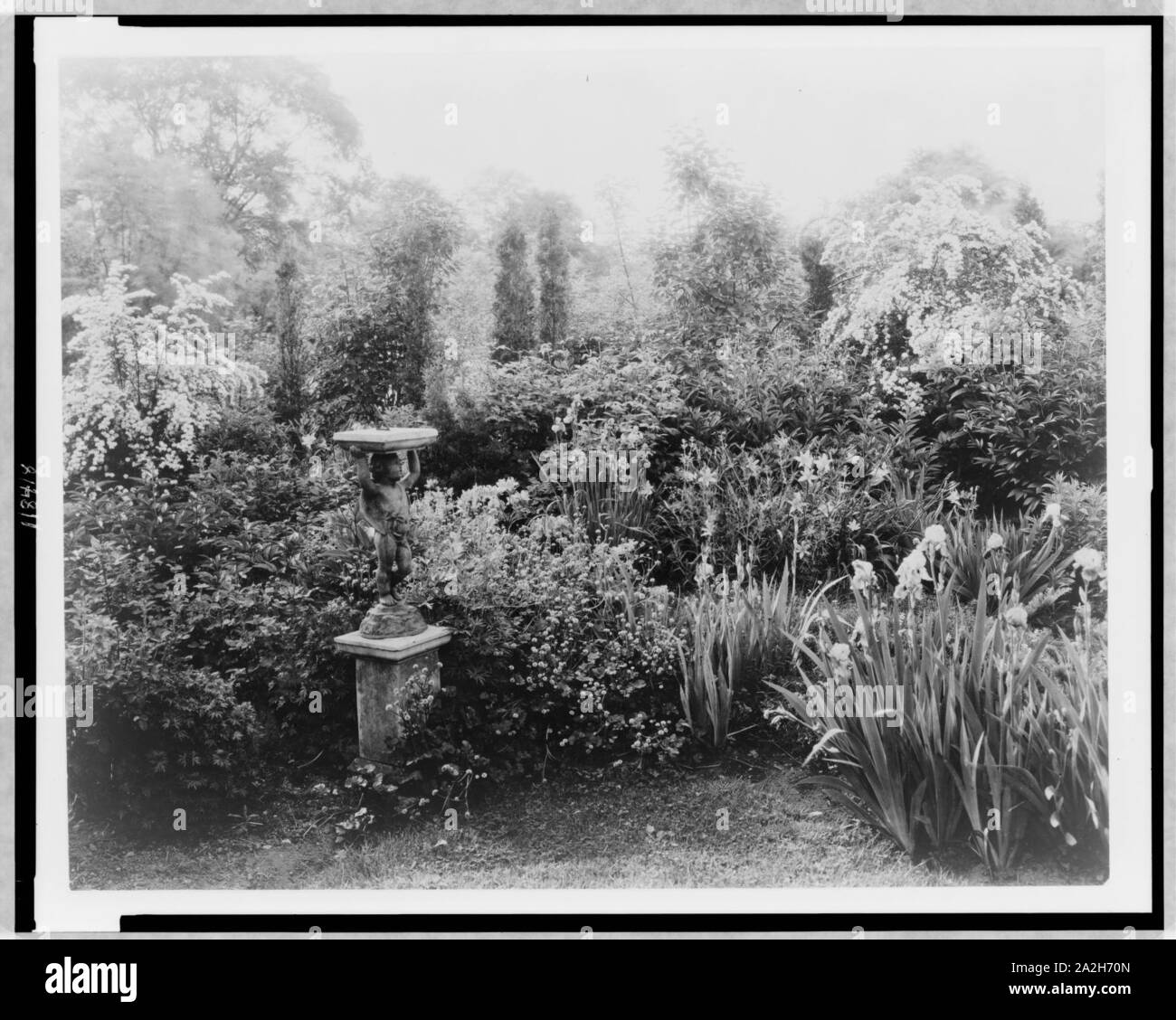 English lead figurine holding sundial, Graham Nichols garden, Greenwich ...
