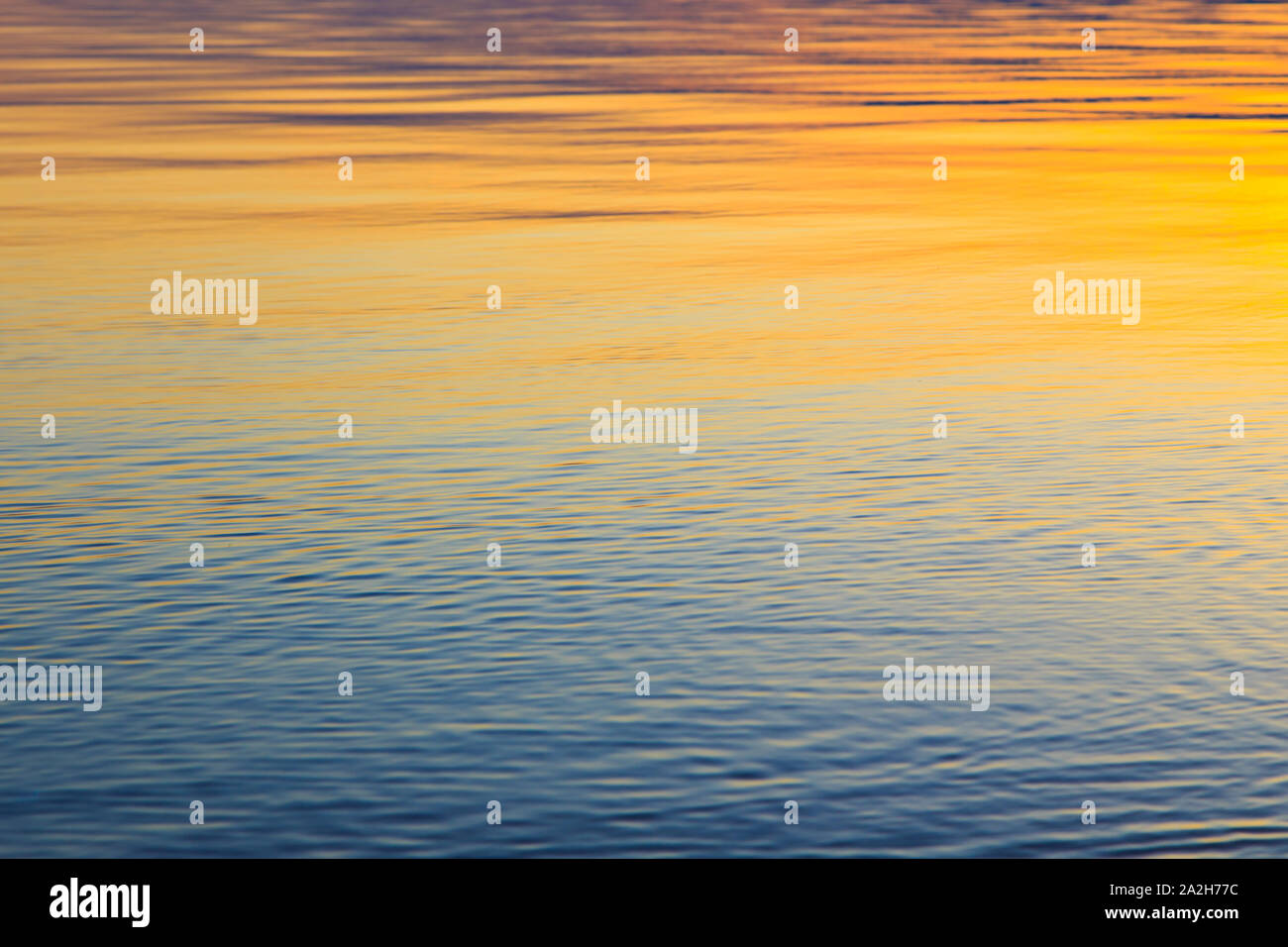 Clear water texture in blue and orange. Background of the ocean and the ...