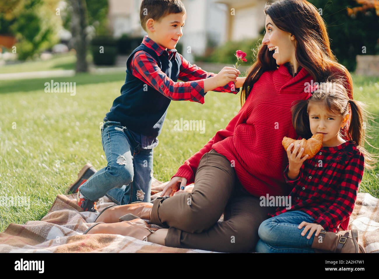 Cute family in a autumn park. Happy mother with two children. Family in ...