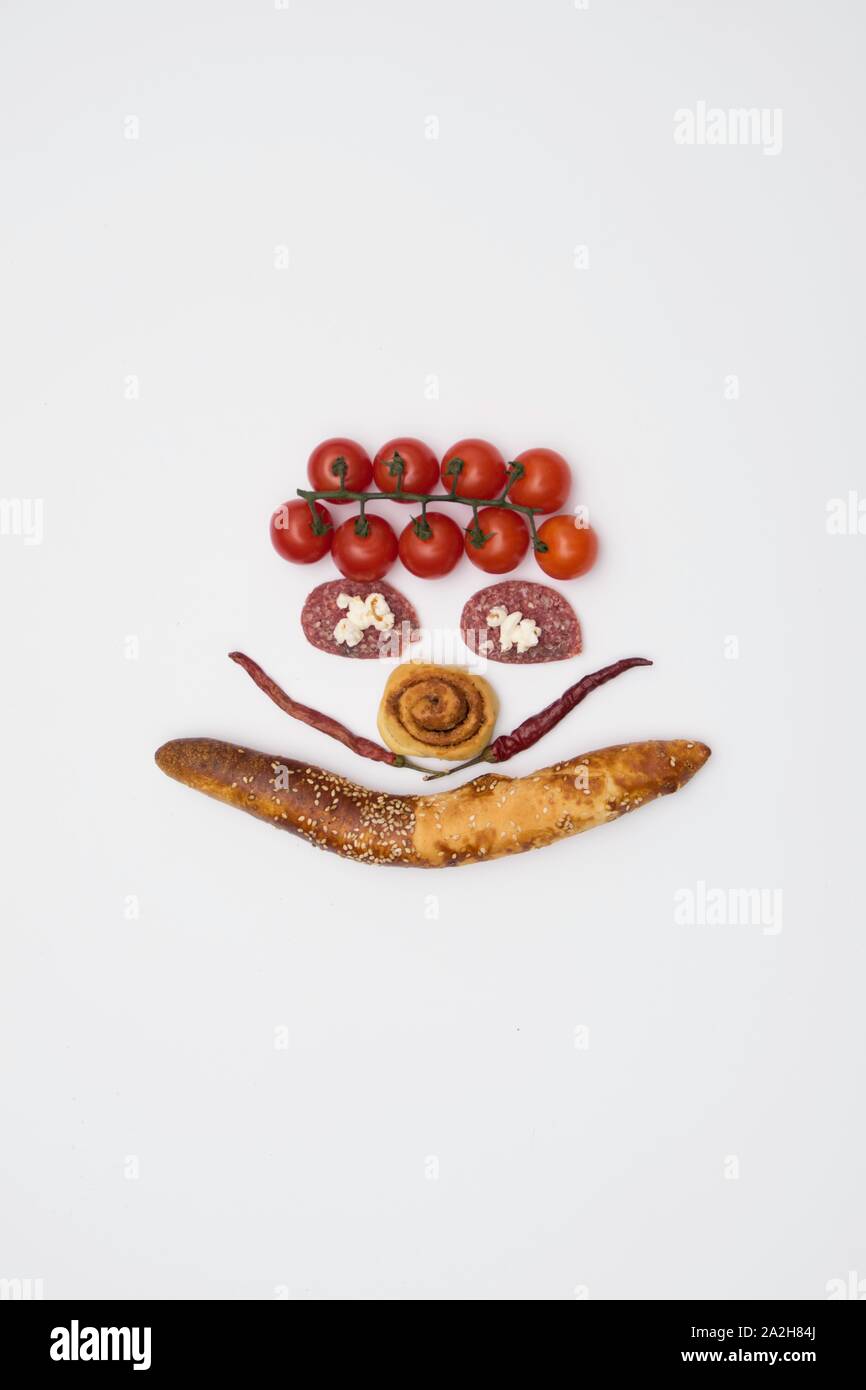 Mustache smiling face of food on a white background Stock Photo - Alamy