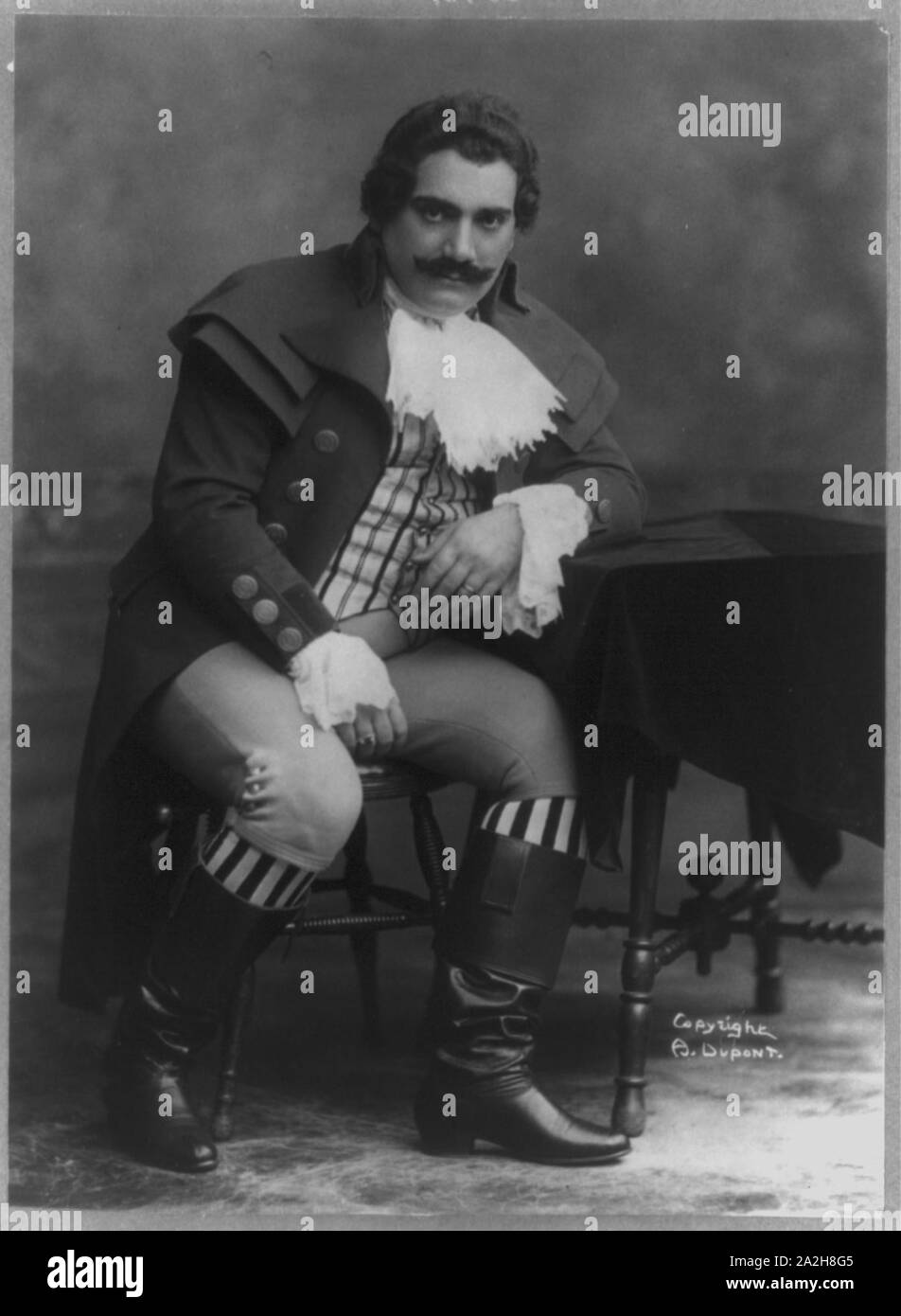 Enrico Caruso, 1873-1921, full-length portrait, seated, facing right ...
