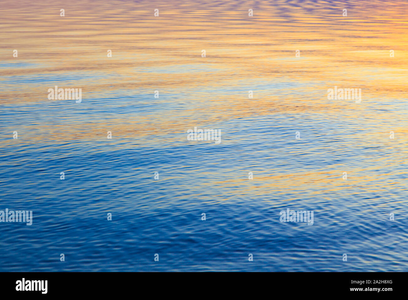 Clear water texture in blue and orange. Background of the ocean and the ...