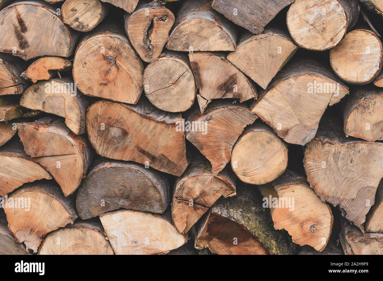 Pile of wood, firewood. Vintage style. Rough surface, texture. Abstract ...