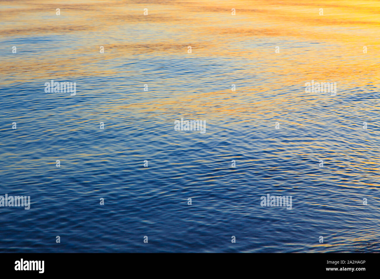 Clear water texture in blue and orange. Background of the ocean and the ...