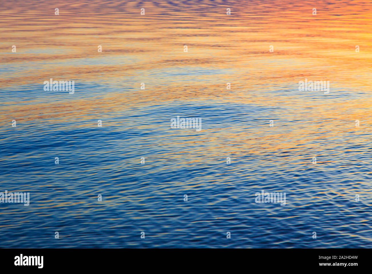 Clear water texture in blue and orange. Background of the ocean and the ...
