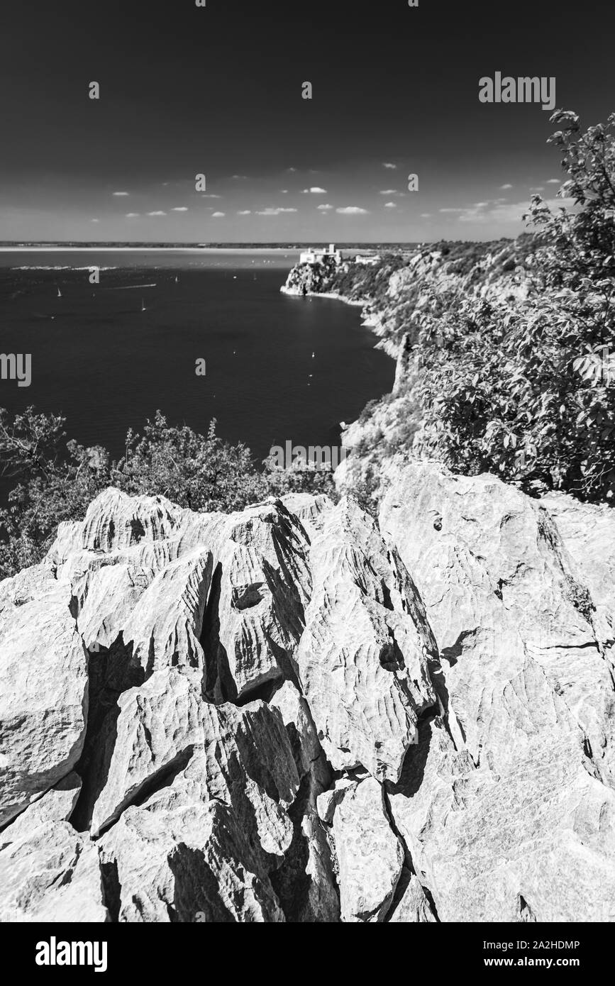 Gulf of Trieste. High cliffs Between boats, karst rocks and ancient ...
