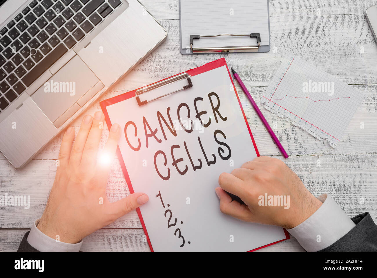 Handwriting text writing Cancer Cells. Conceptual photo forming solid ...