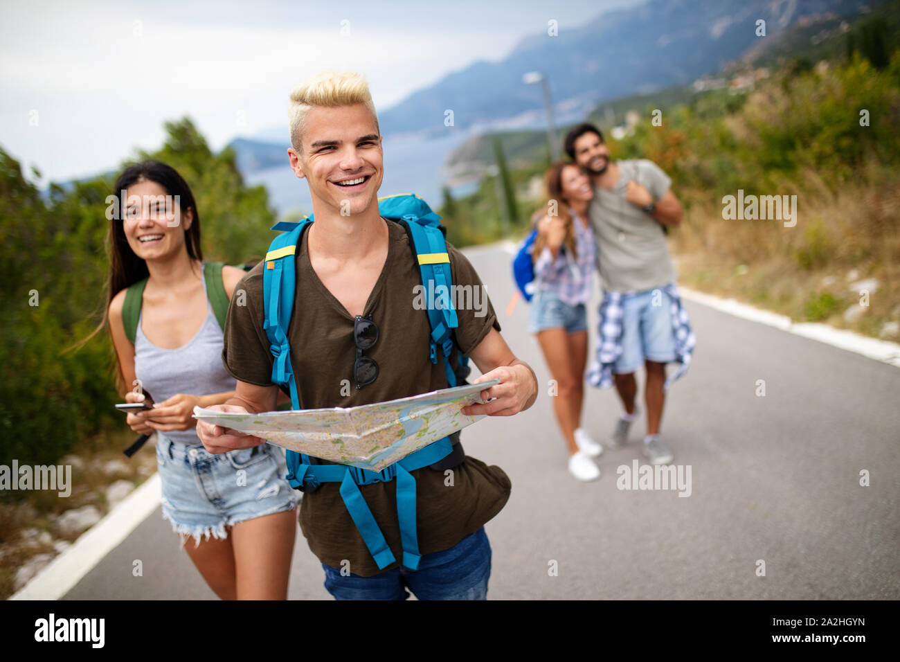 Group of happy friend traveler walking and having fun. Travel lifestyle ...