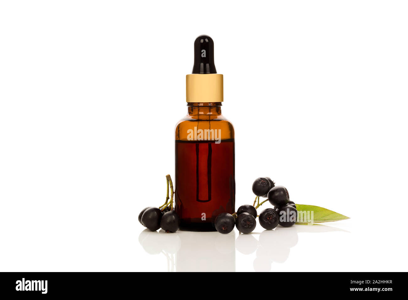 Bottle of chokeberry extract isolated on white background Stock Photo ...