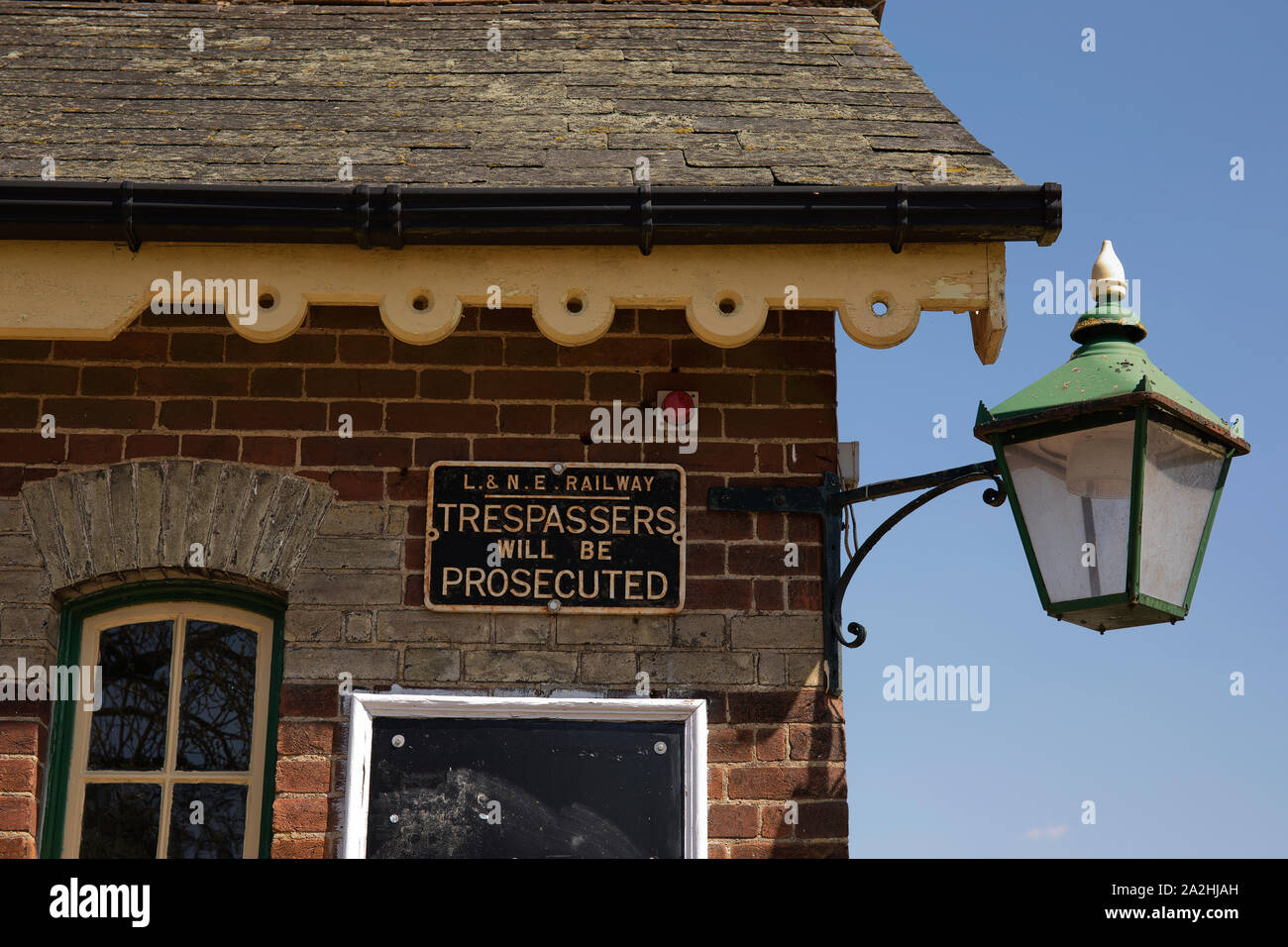 Old fire bucket bracket on railway station wall Stock Photo - Alamy