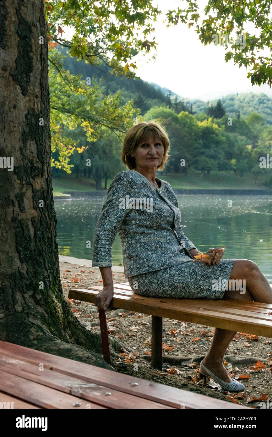 Attractive senior lady in the park. Healthy and active lifestyle ...