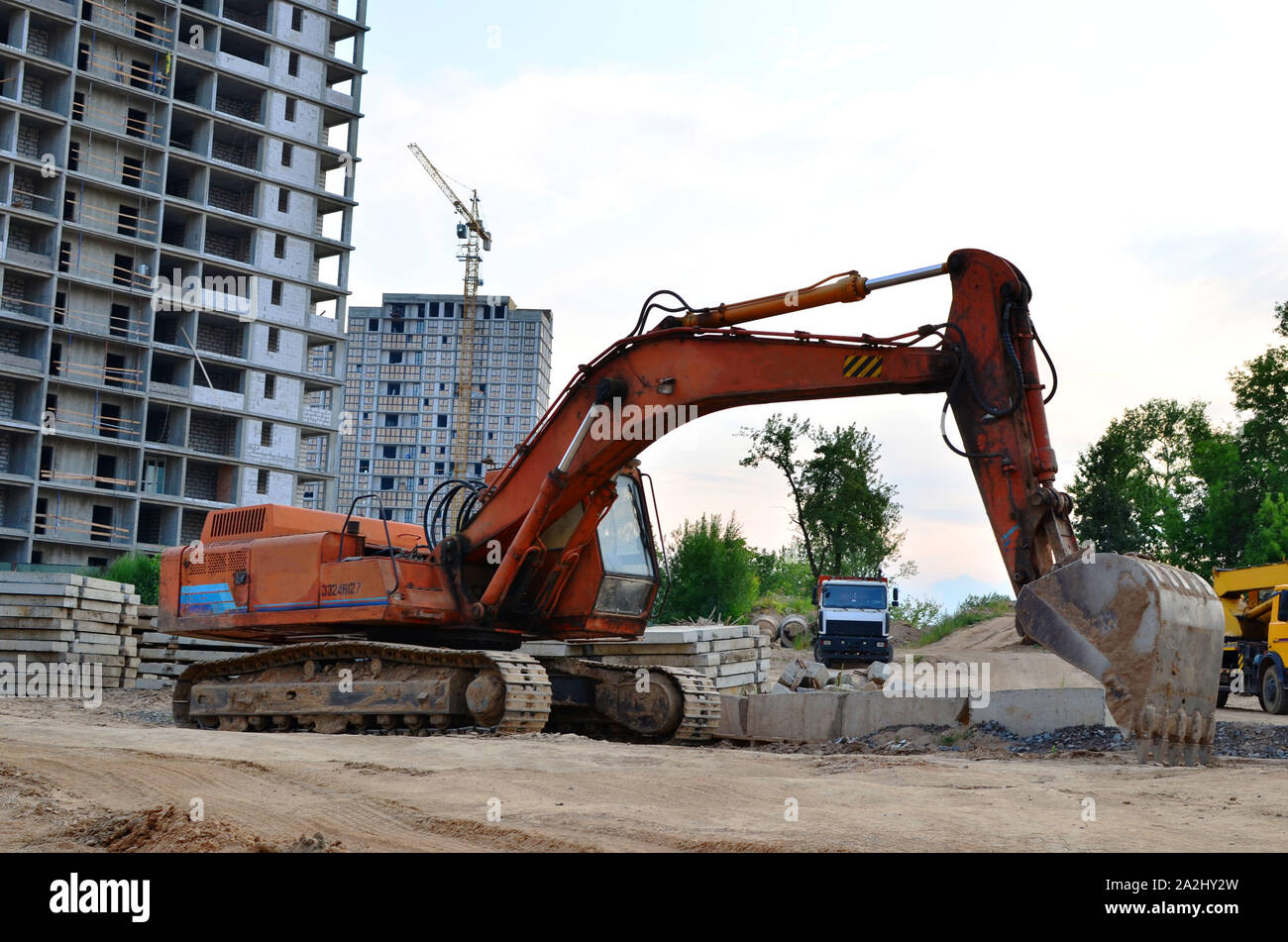 Excavator on the construction site against the background of a high ...
