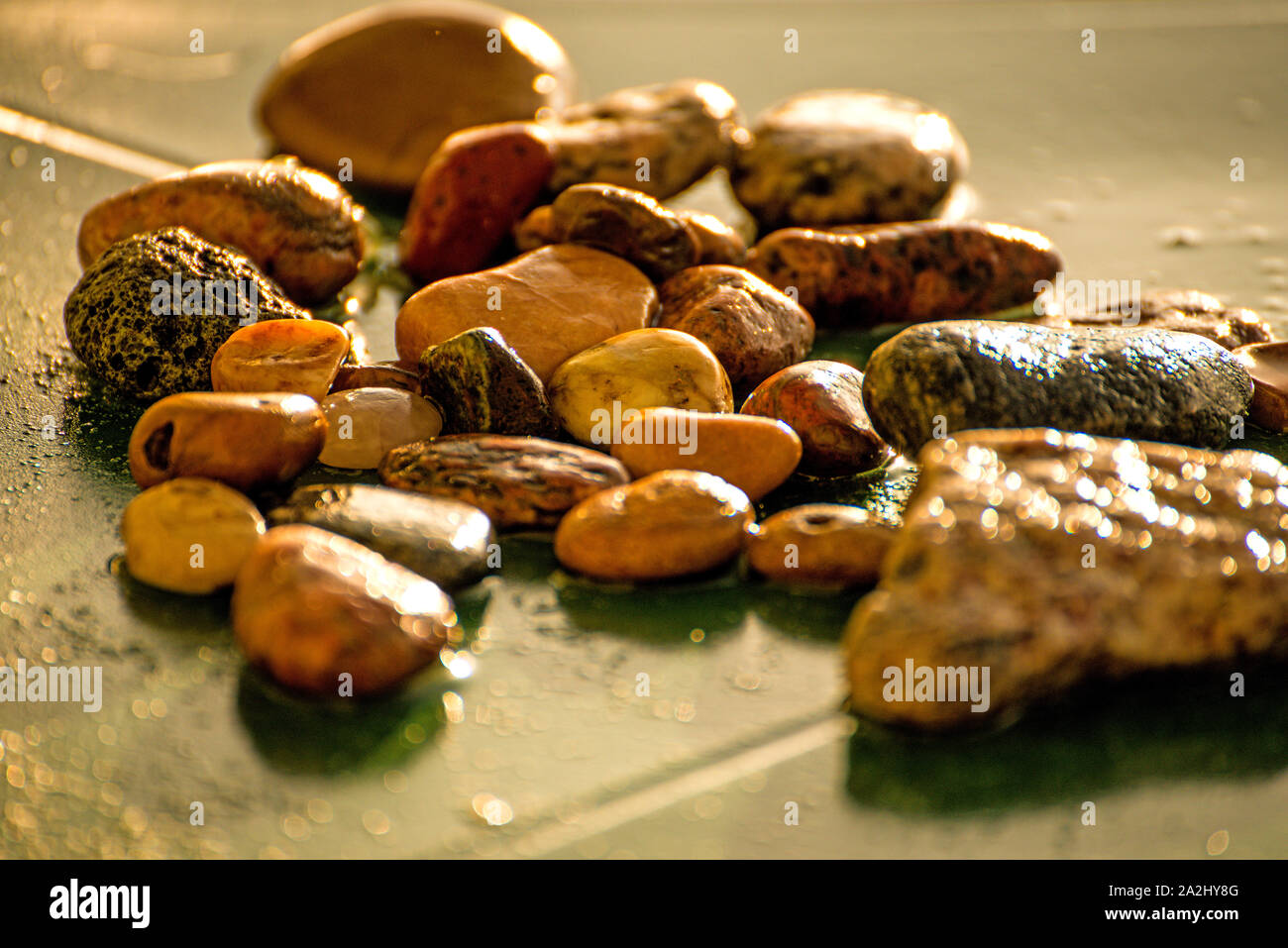 pebbles stones in rain on a desk Stock Photo - Alamy