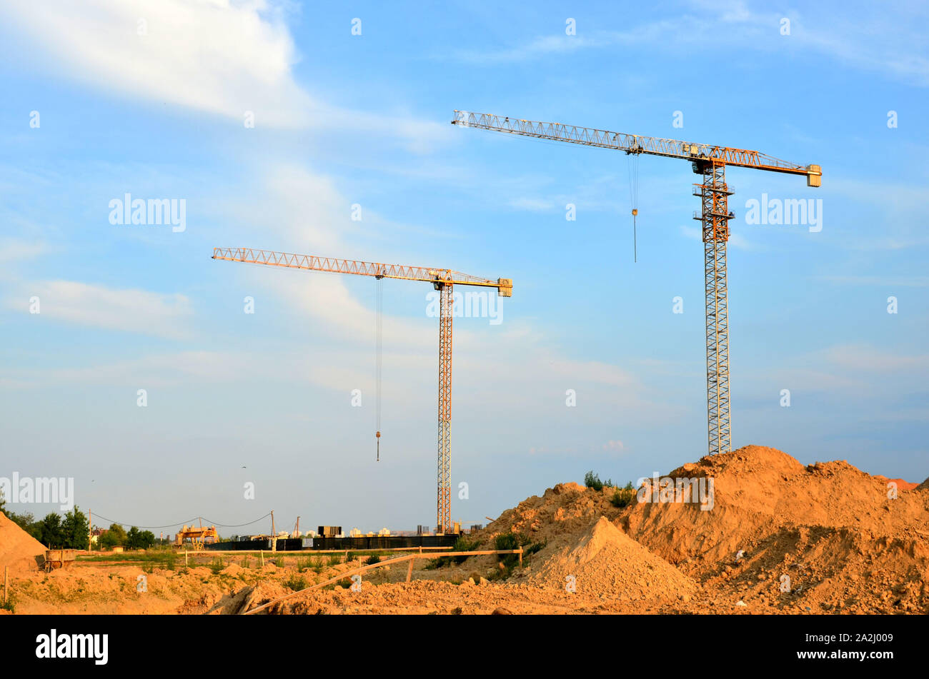 Tower cranes at construction site, construction of high-rise building ...