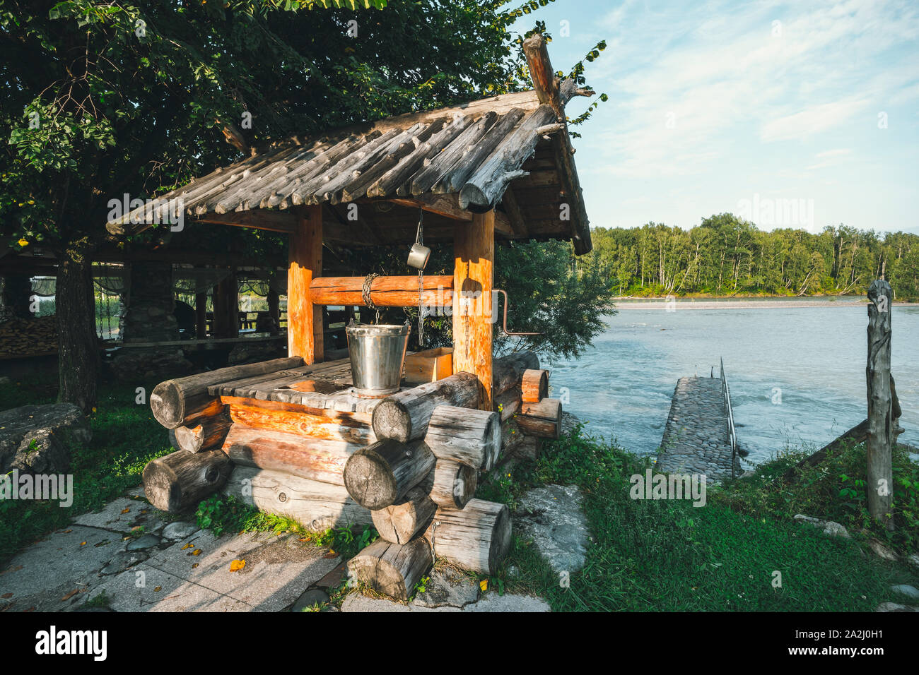 Traditional village well on the background of beautiful nature with a ...