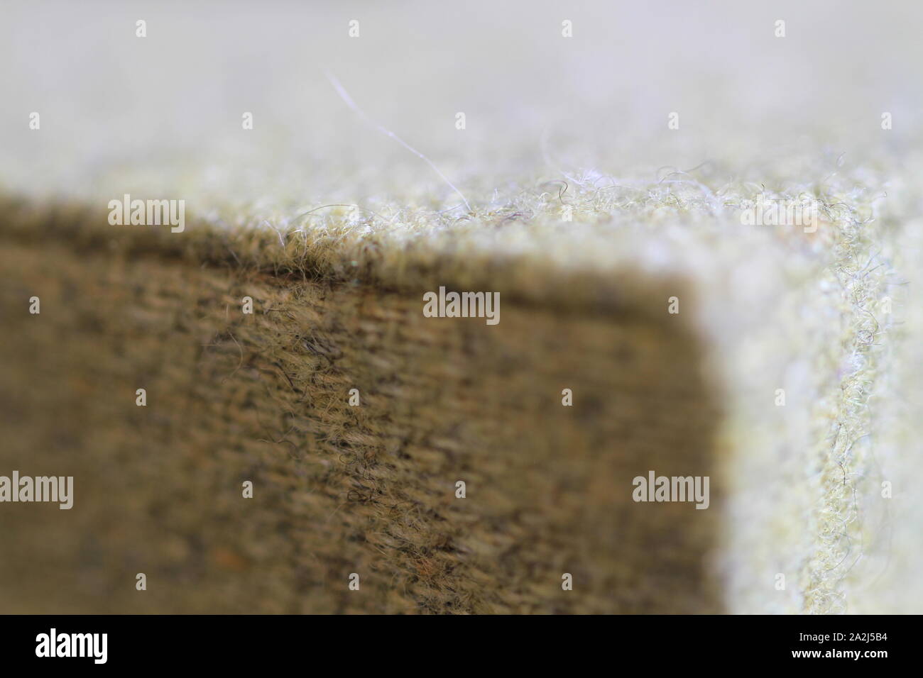 Wool edge fabric surface under macro lens Stock Photo - Alamy