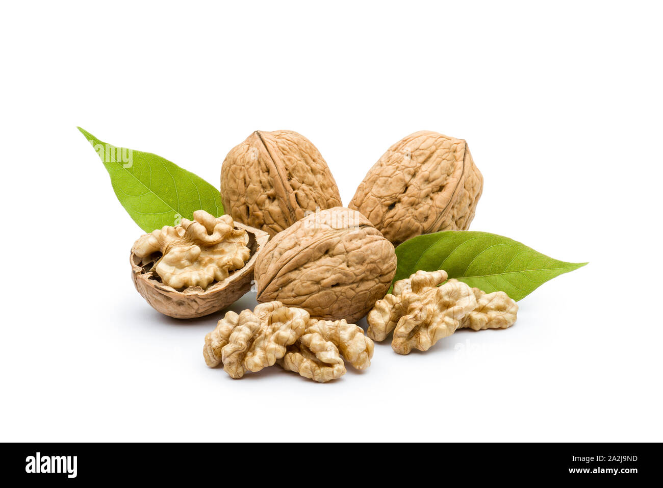 open walnut closeup with leaves on white background Stock Photo - Alamy