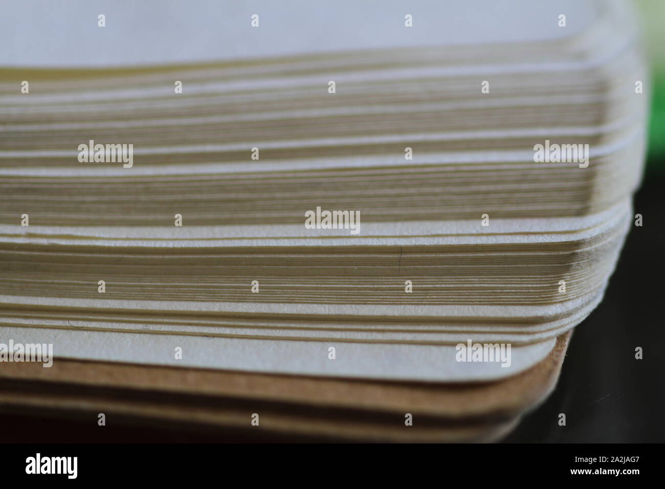 White paper edge on dark background under close up lens Stock Photo - Alamy