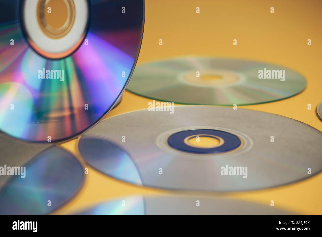 Close up Beautiful Old dirty CDs,DVD on yellow background Stock Photo ...