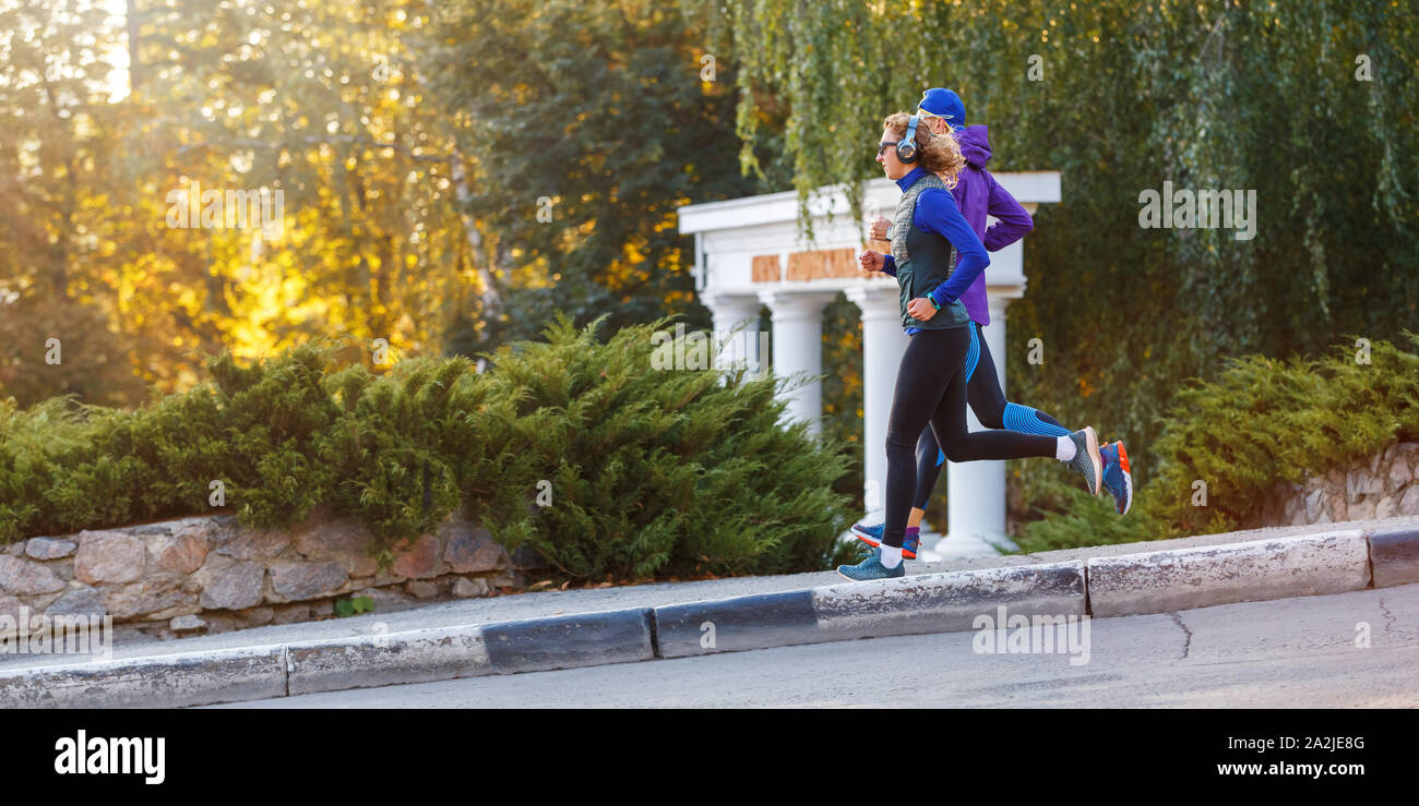 Man woman running hill hi-res stock photography and images - Alamy