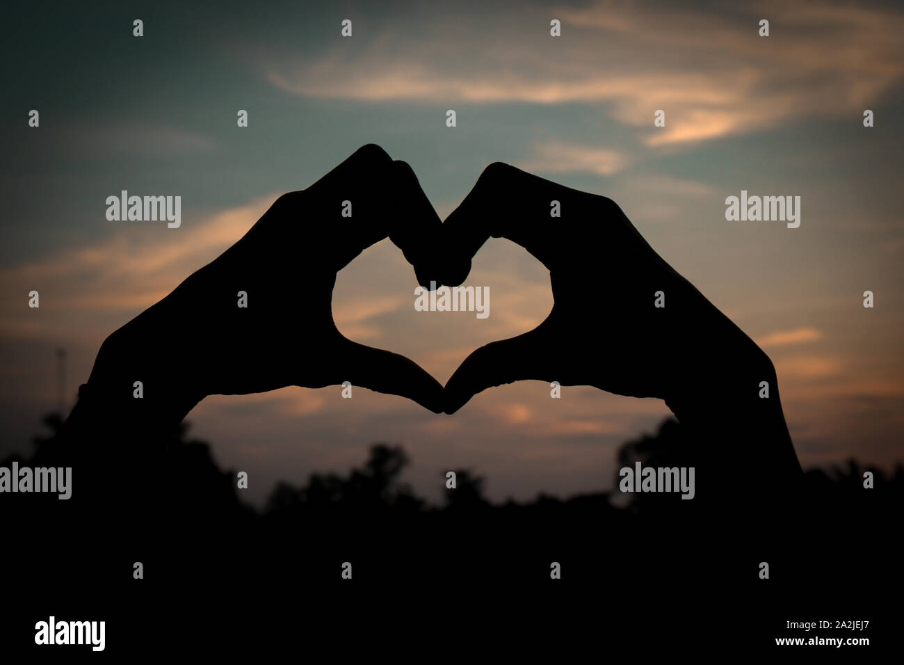 Heart made hands silhouette hi-res stock photography and images - Alamy