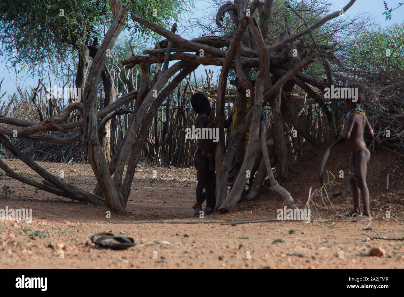 Turmi, Ethiopia - Nov 2018: Group of hamer tribe kids at the entrance ...
