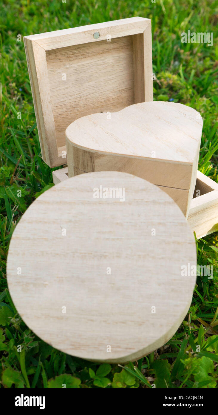 Wooden boxes on a green grass Stock Photo - Alamy