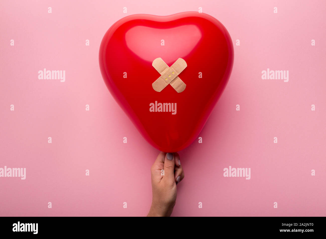Woman cut heart shape paper hi-res stock photography and images - Alamy